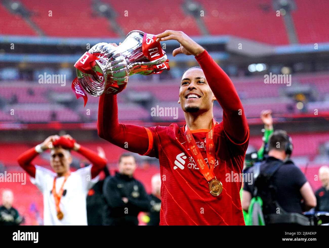 Liverpool's Virgil van Dijk celebrates with the trophy after winning ...