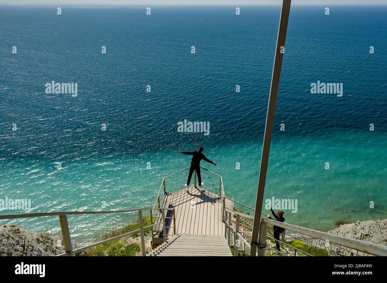 A viewing platform on a rock with steps overlooking the Black Sea in ...