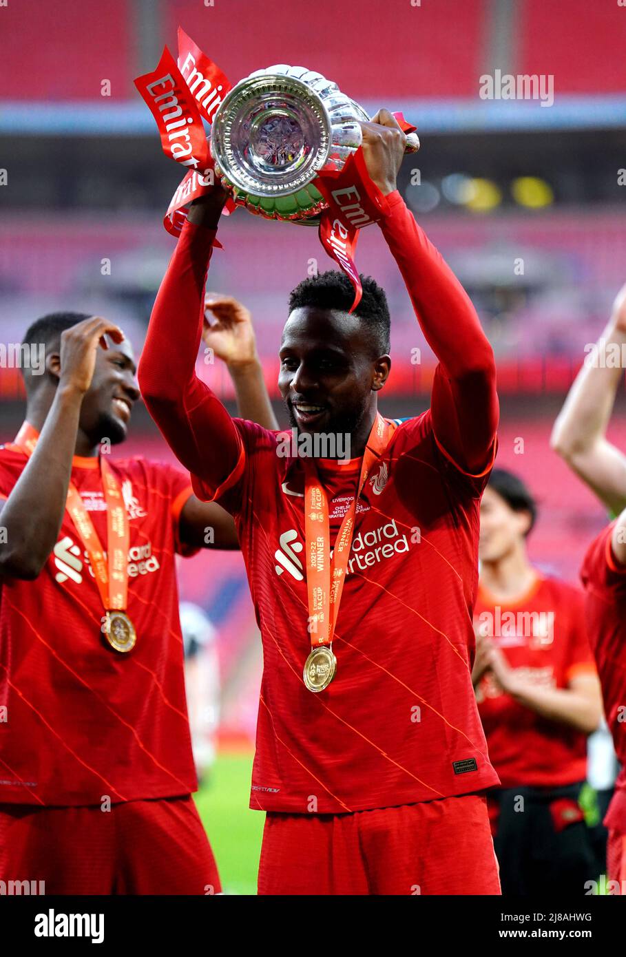 Liverpool's Divock Origi celebrates with the trophy after winning the ...