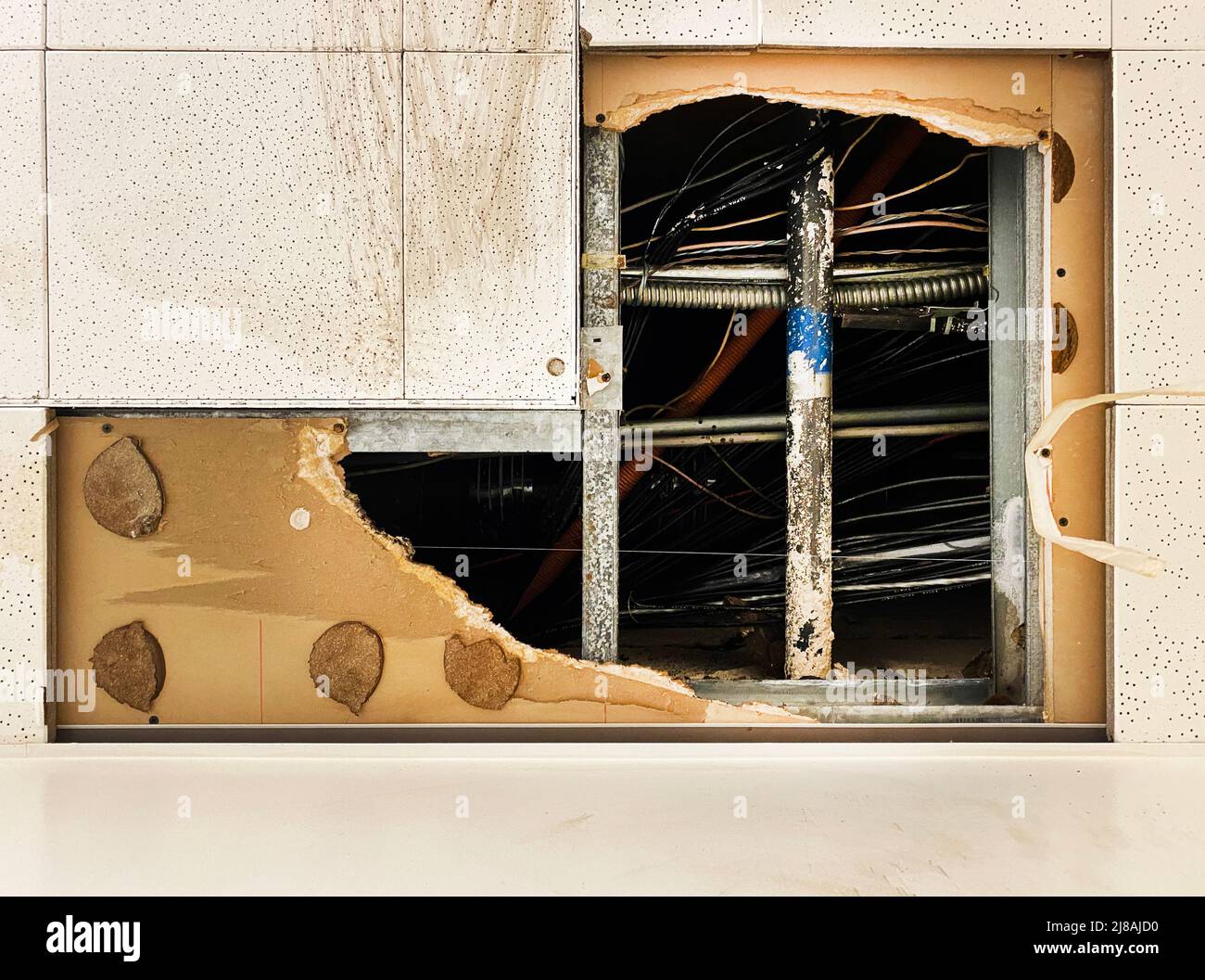 A hole in the ceiling Stock Photo - Alamy
