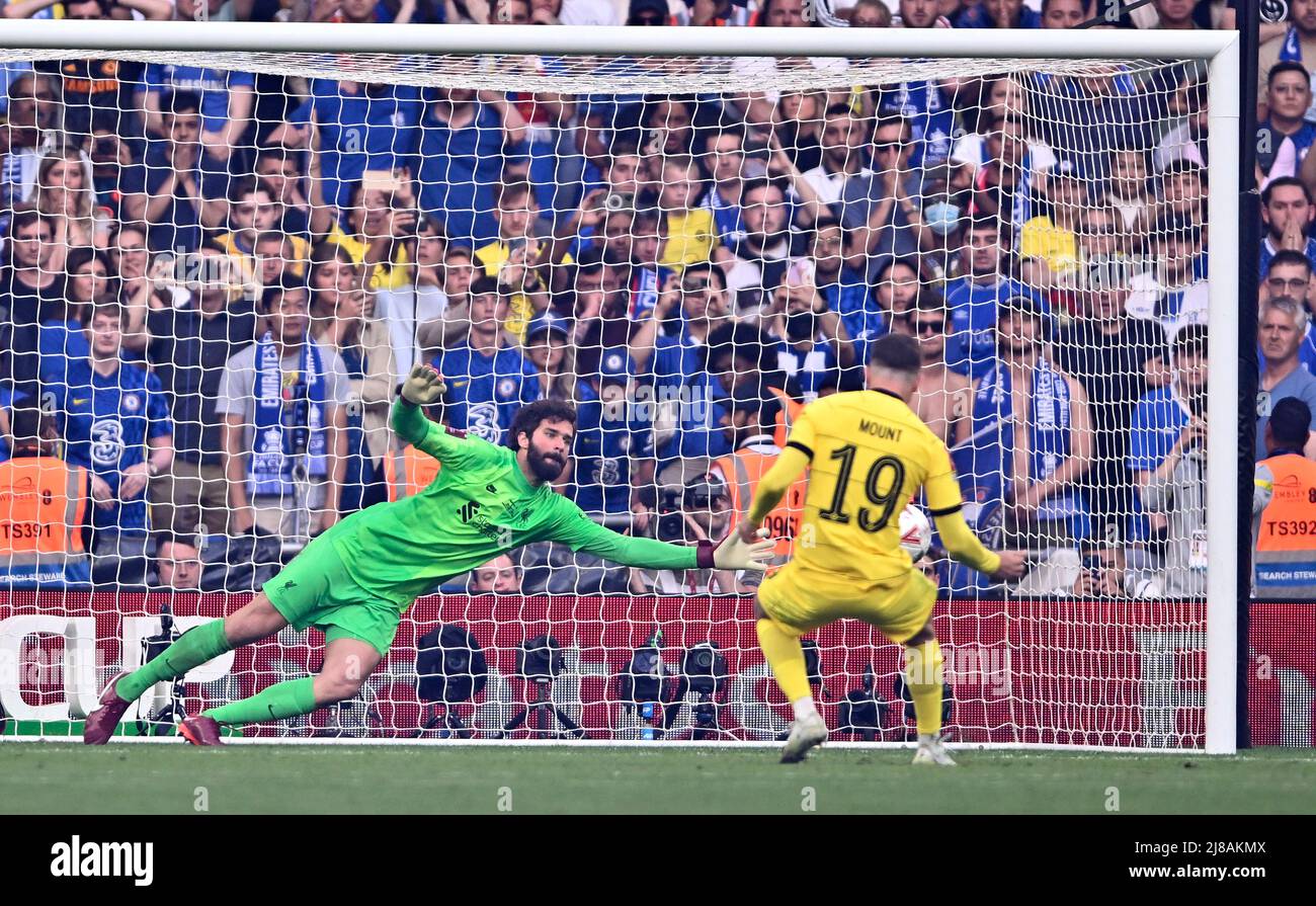 London, UK. 14th May, 2022. Alisson (Liverpool, goalkeeper) dives to ...