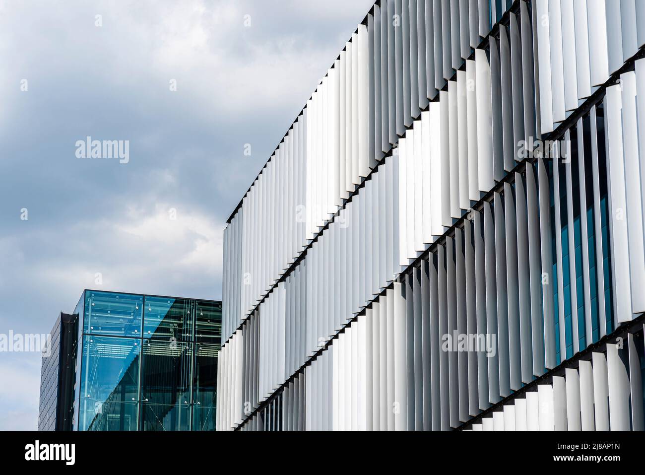 The facade of a modern building with an innovative facade made of ...