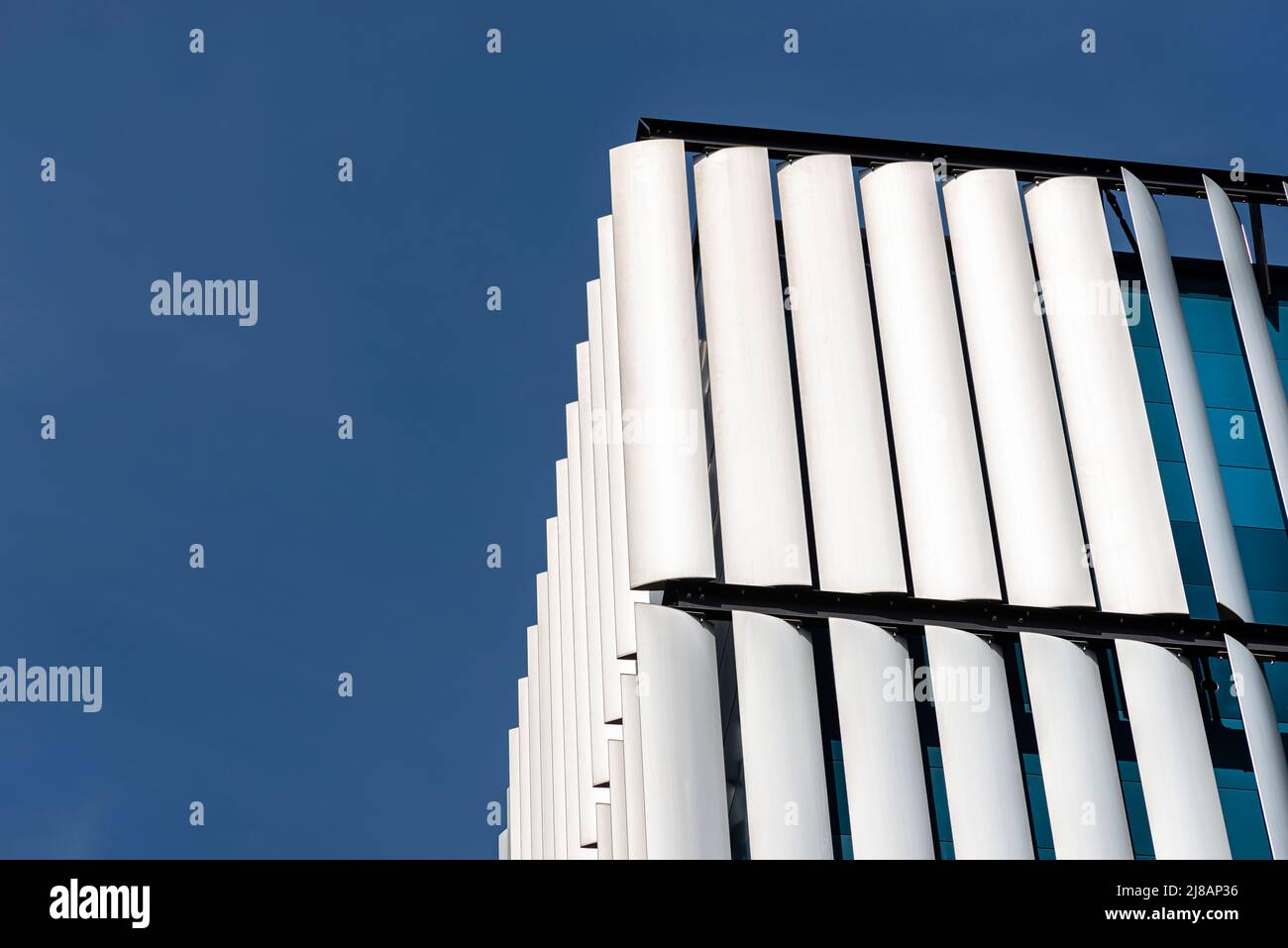 The facade of a modern building with an innovative facade made of ...