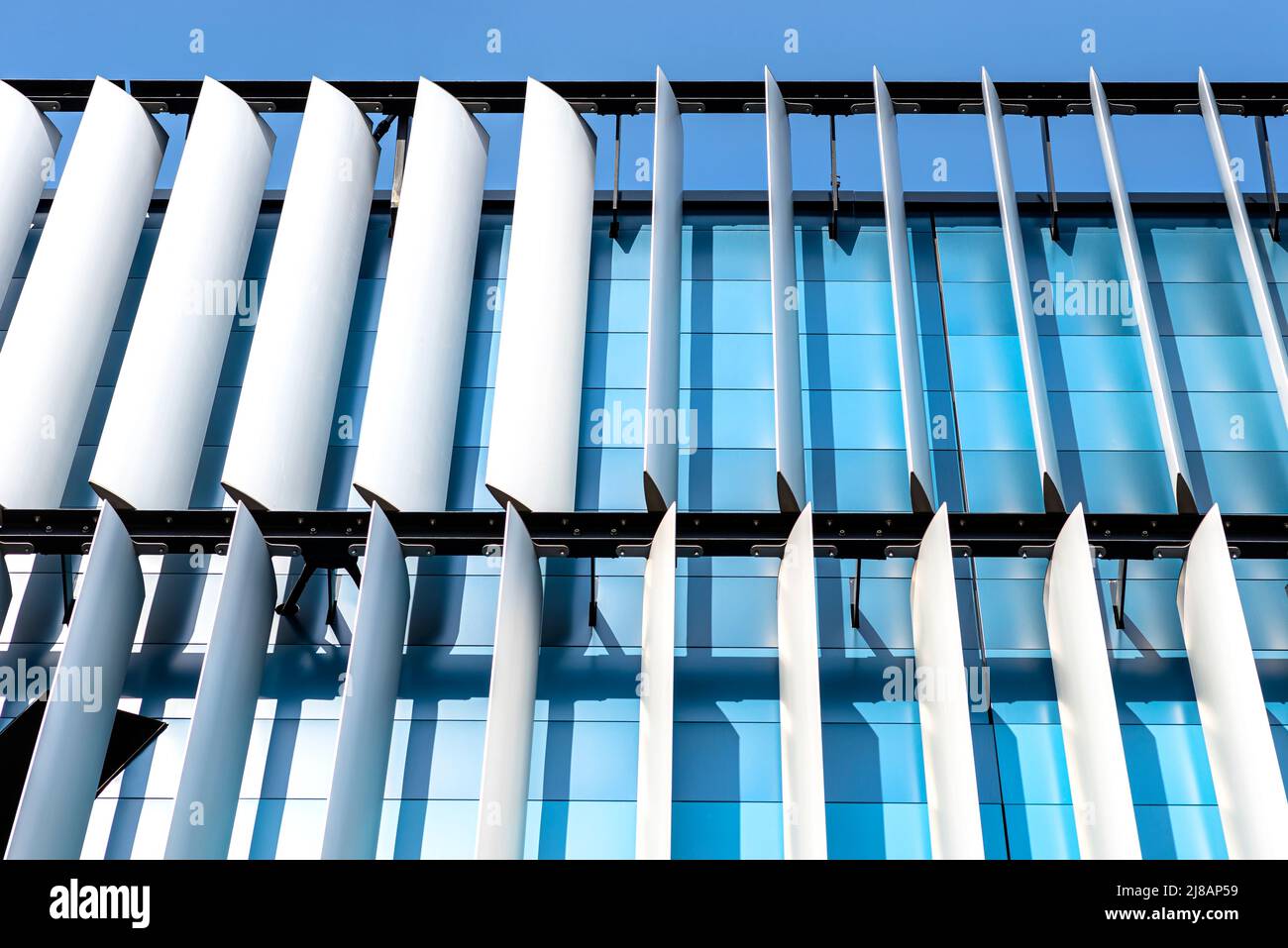 The facade of a modern building with an innovative facade made of ...