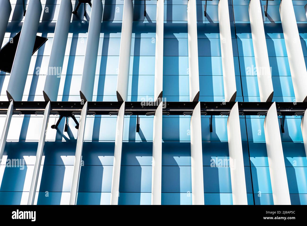 The facade of a modern building with an innovative facade made of ...