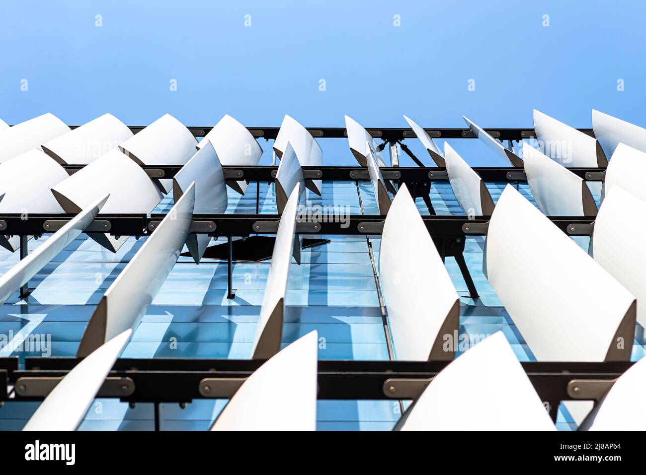 The facade of a modern building with an innovative facade made of ...