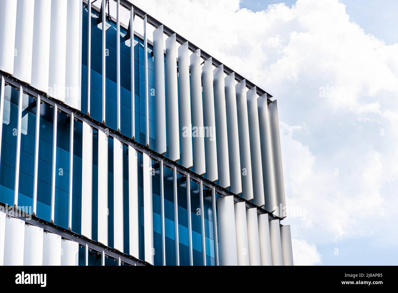 The facade of a modern building with an innovative facade made of ...