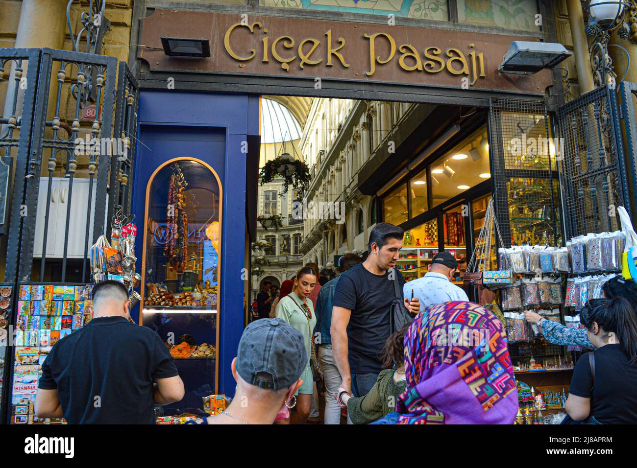 People walk through an entrance of famous Cicek Pasaji (Flower Passage ...