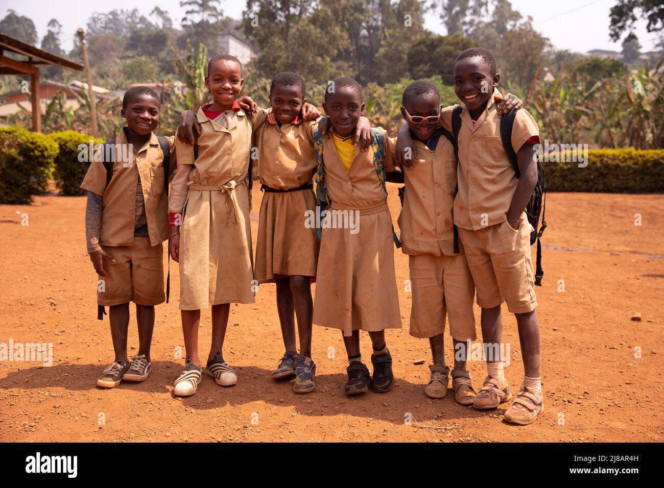 Group of schoolchildren standing out in the schoolyard. Friendship ...