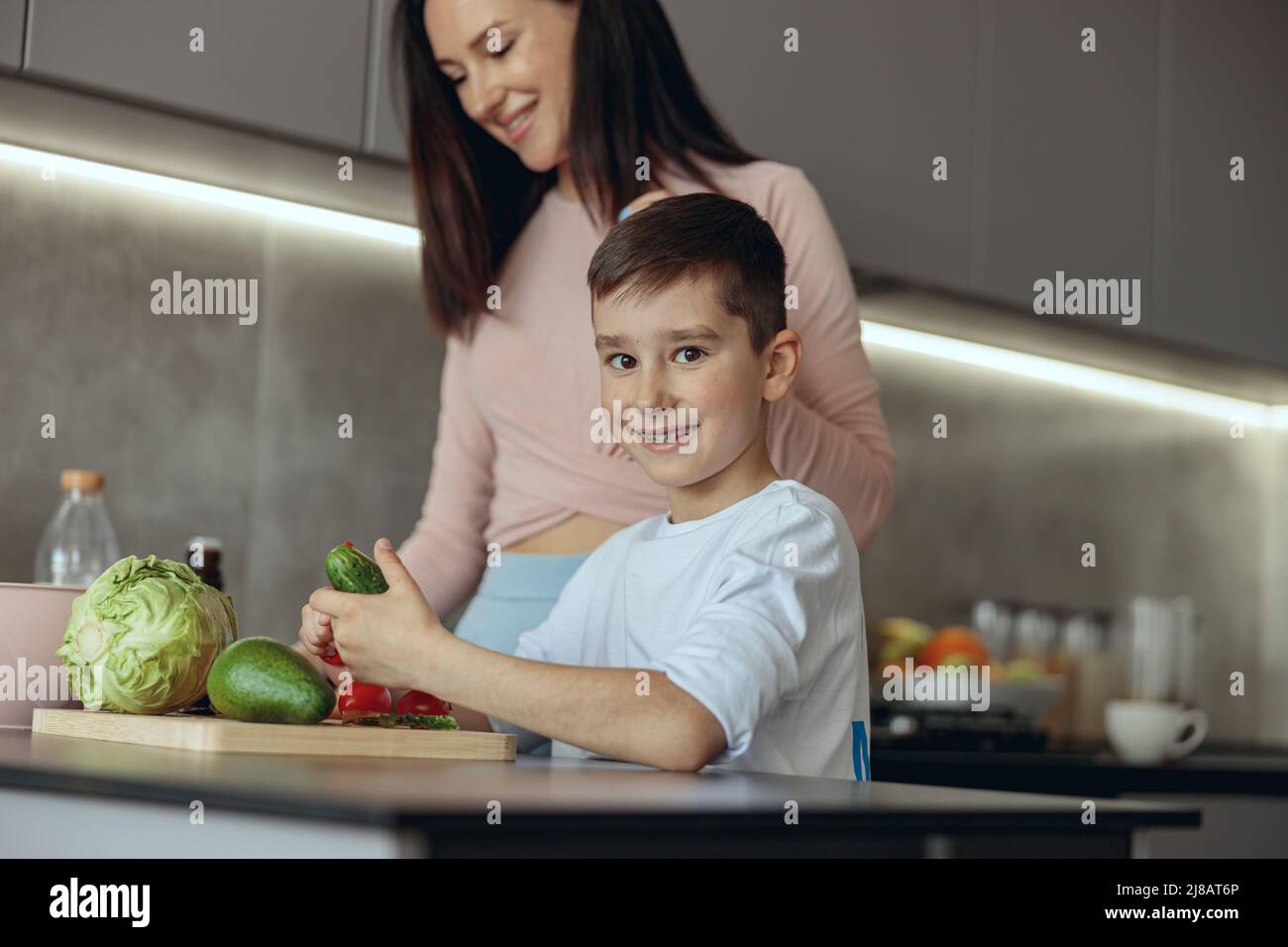 Teen boy cooking with parent hi-res stock photography and images - Alamy