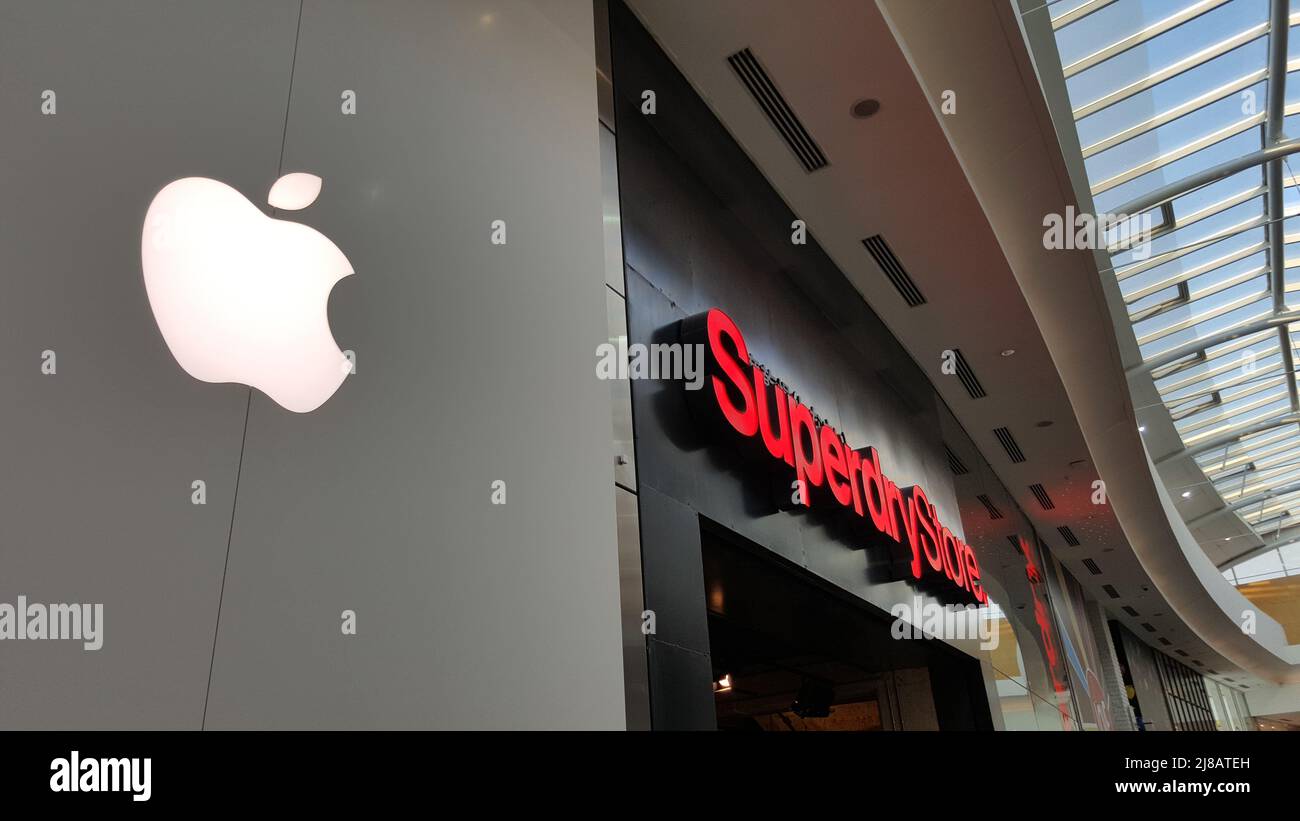 Apple Electronic Shop Logo and Superdry Clothing Shop Sign Stock Photo ...