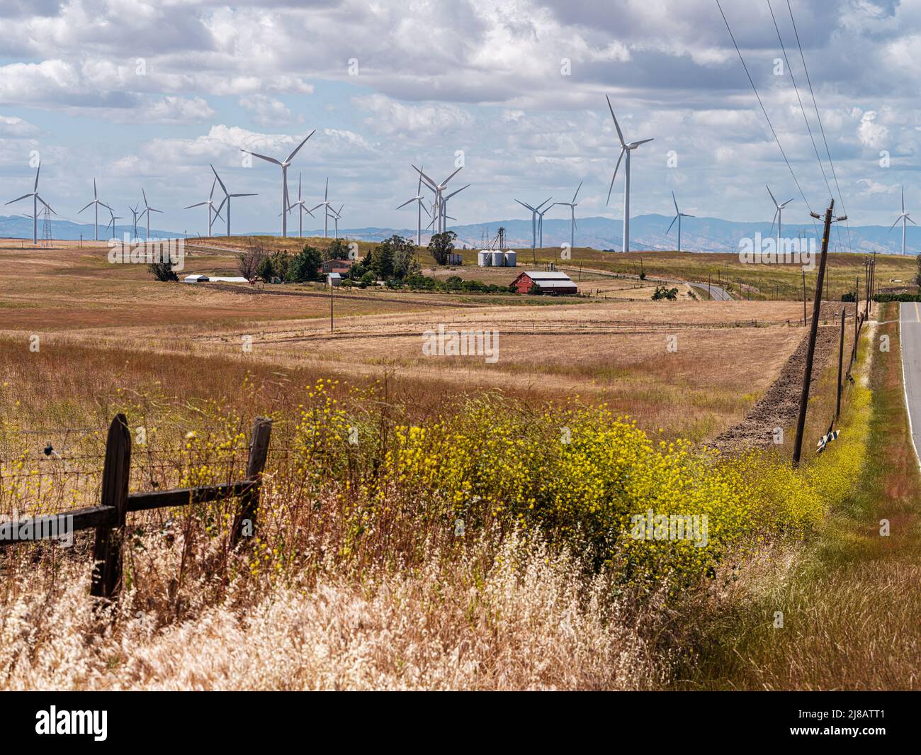 A landscape of wind turbines and farm land. The Shiloh wind power plant ...