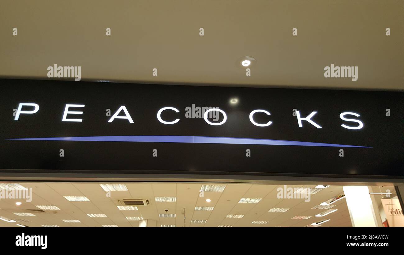 Peacocks Clothing Shop Sign And Logo Stock Photo - Alamy
