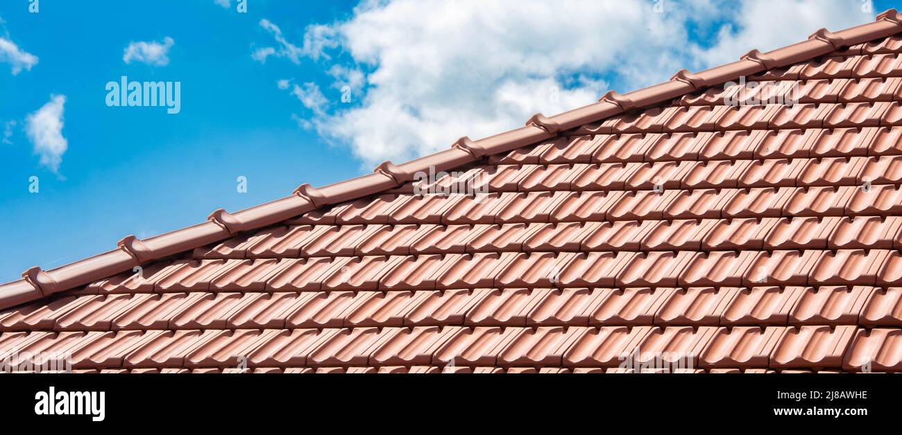 new red tiles roof and blue sky Stock Photo - Alamy