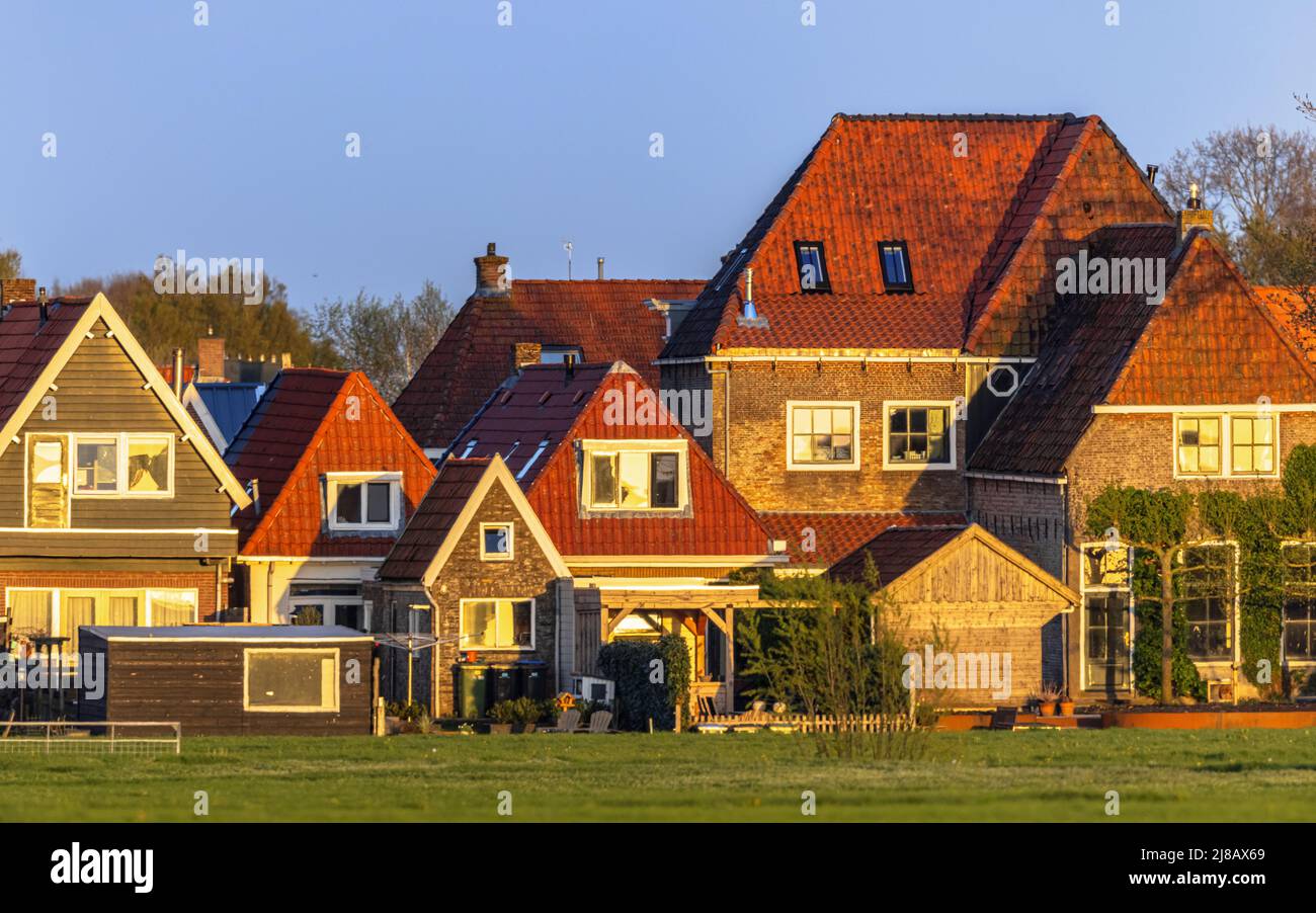 Detail of village with historic dutch buildings in the sun. Workum ...