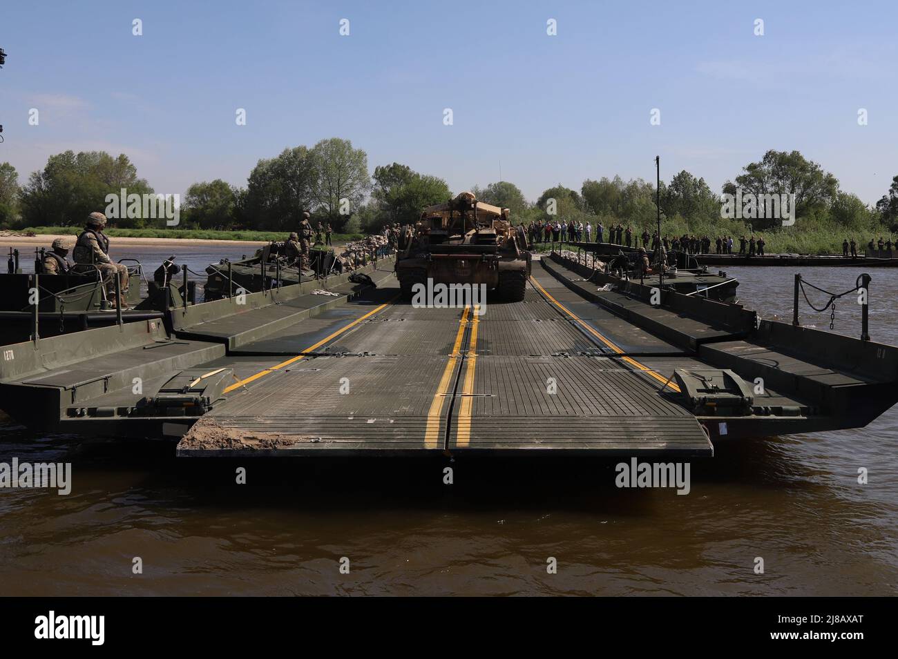 An M1A2 Abrams Tank crosses the ribbon bridge during a wet gap crossing ...