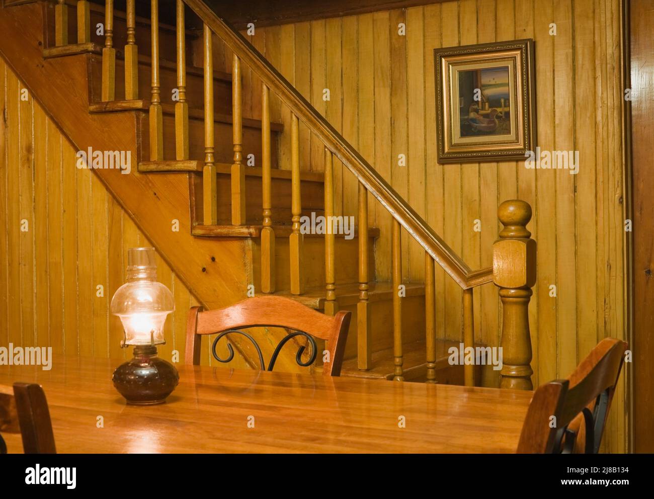 Antique table with chairs, staircase in dining room inside old circa ...