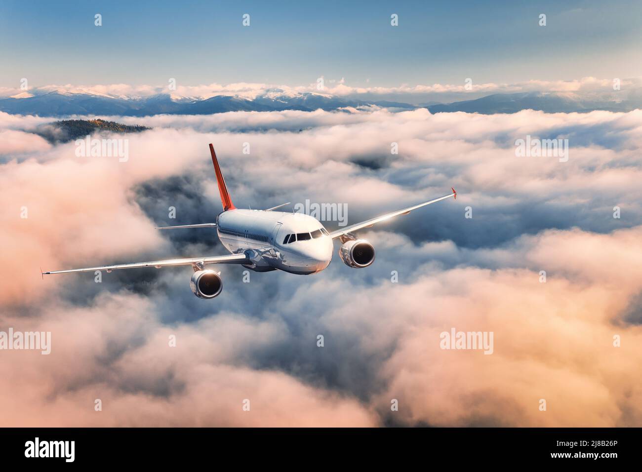 Airplane above clouds sunrise hi-res stock photography and images - Alamy