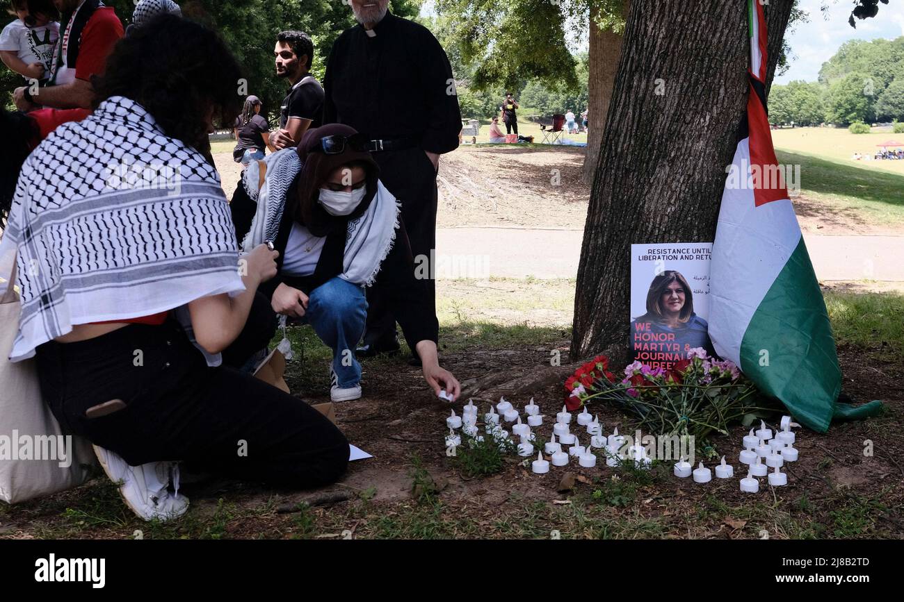 Atlanta, Georgia, USA. 14th May, 2022. Mourners place candles at a ...