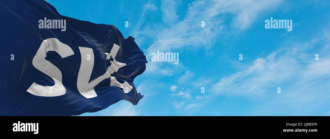 official flag of SVT , Sweden at cloudy sky background on sunset ...