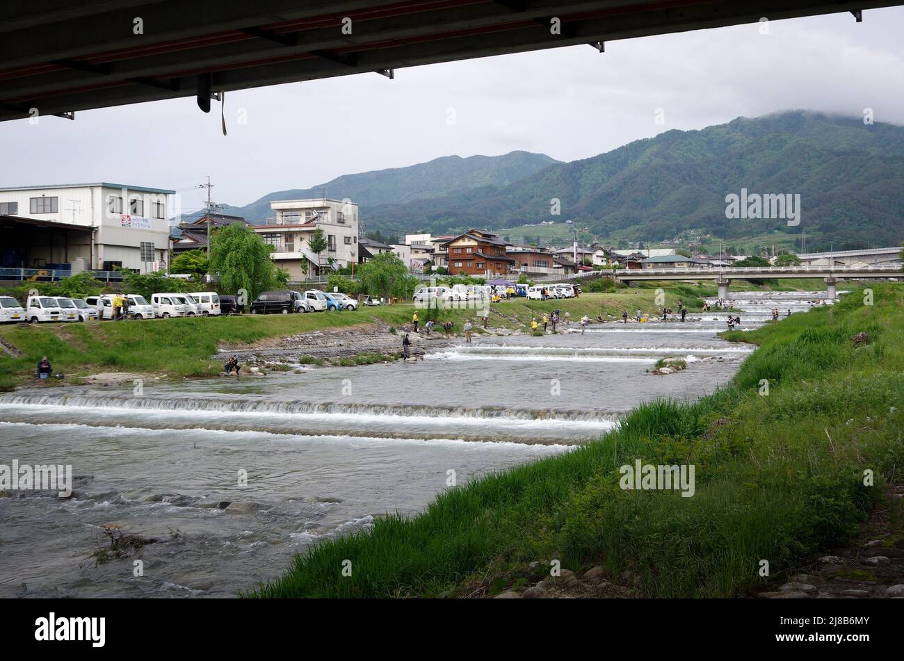 iida, nagano, japan, 2022/15/05 , People fishing during an event at ...