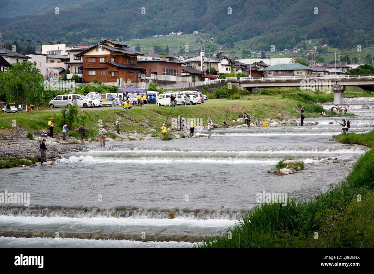 iida, nagano, japan, 2022/15/05 , People fishing during an event at ...