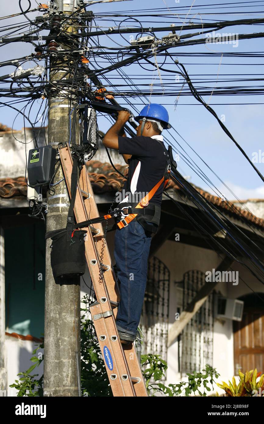 Telephone repairman climbing telephone pole hi-res stock photography ...