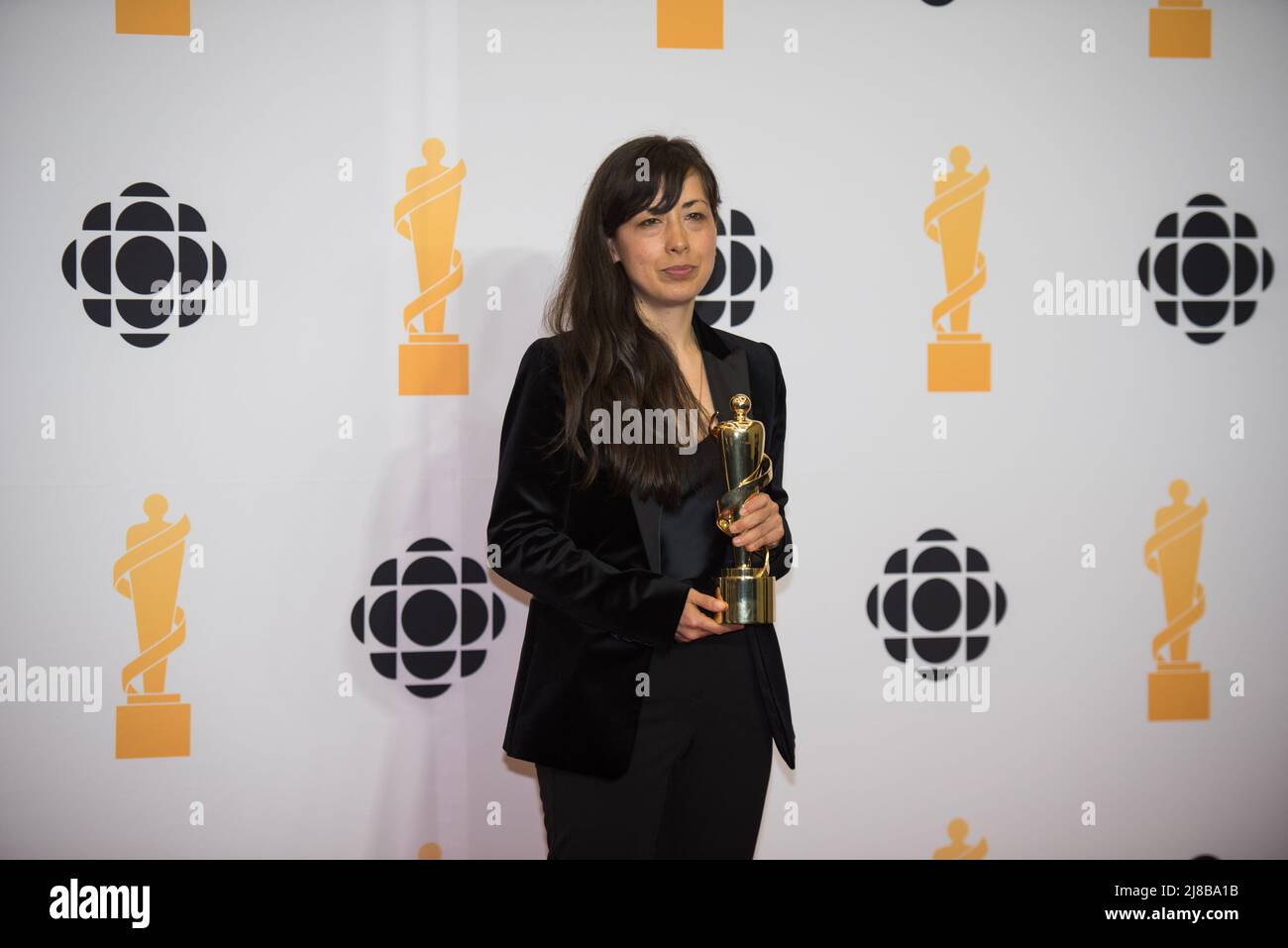 Keiko Devaux poses for a photograph at the media wall after winning ...