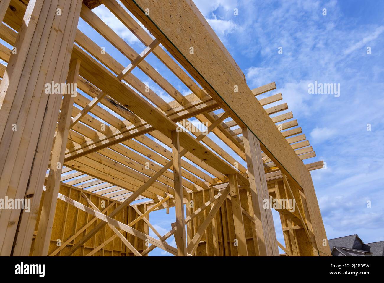 Framing of beams stick built house on new home under construction Stock ...