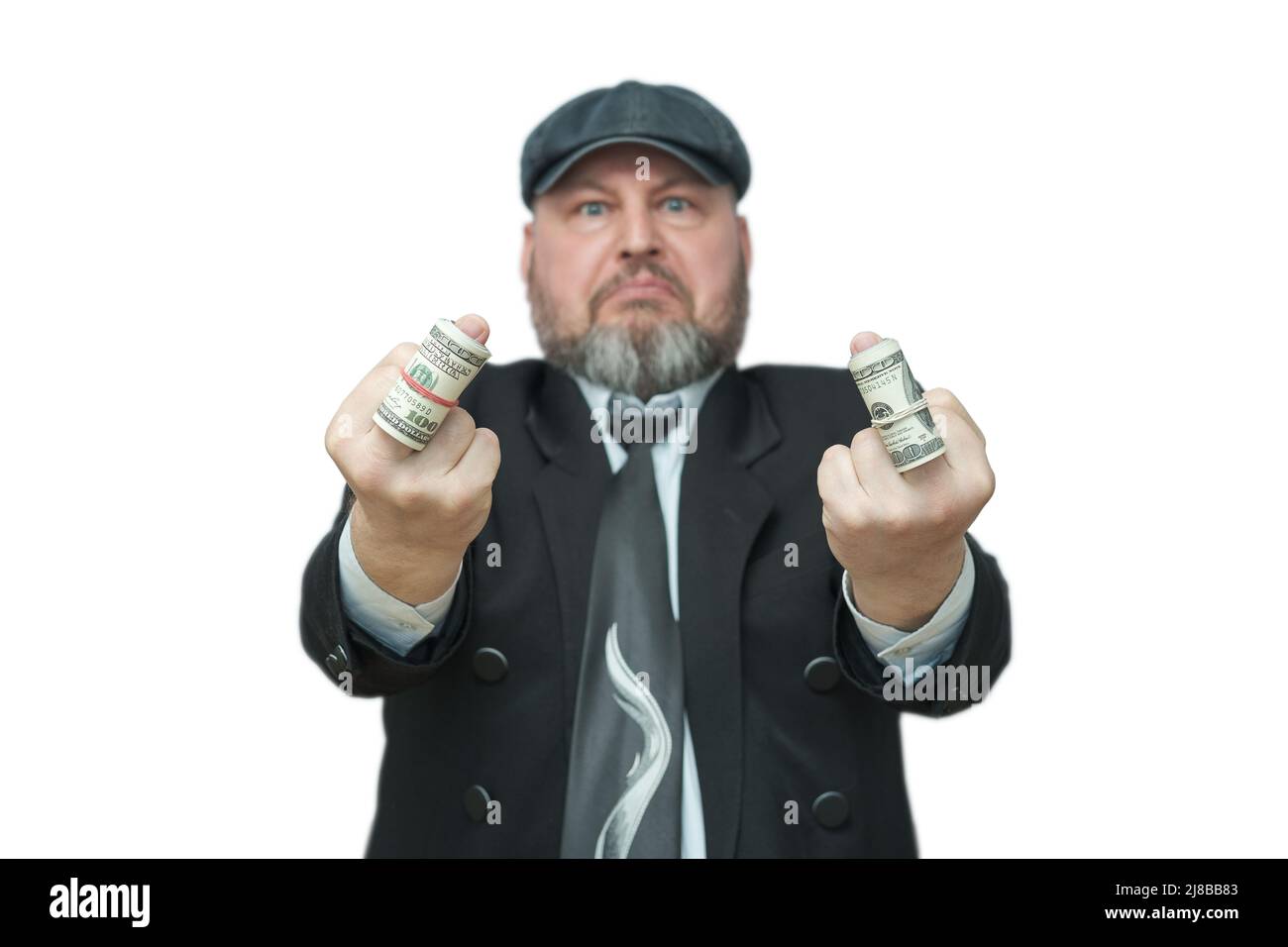 A man shows the middle finger on which dollars are rolled up into a ...