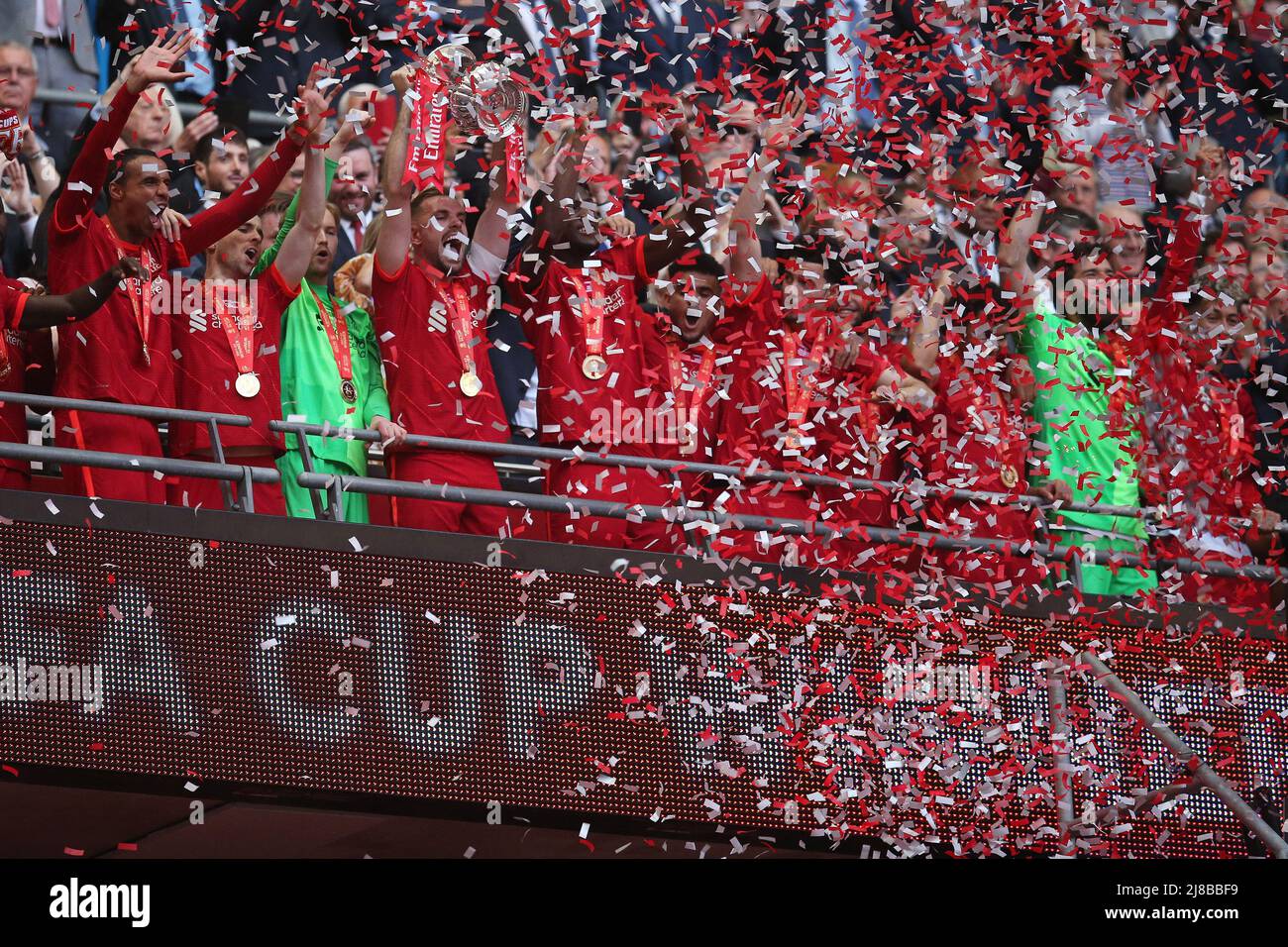 London, UK. 14th May, 2022. Jordan Henderson of Liverpool lifts the FA ...