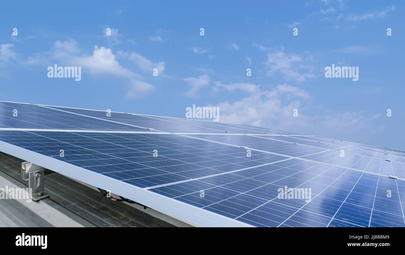 Solar module panels against blue sky background. Environmental energy ...