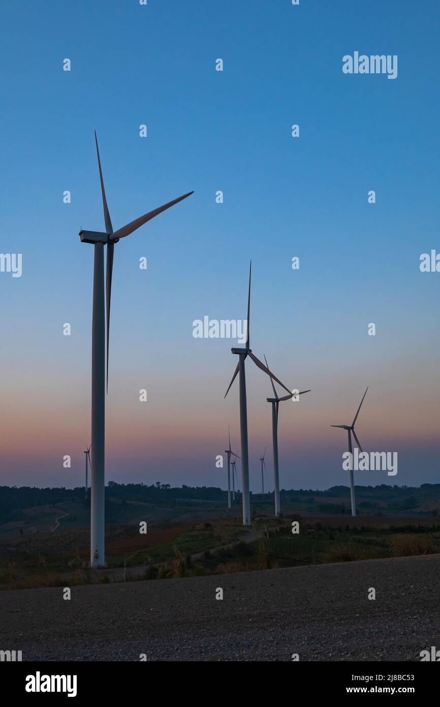 Wind turbines on mountain landscape. Road through mountains wind farm ...