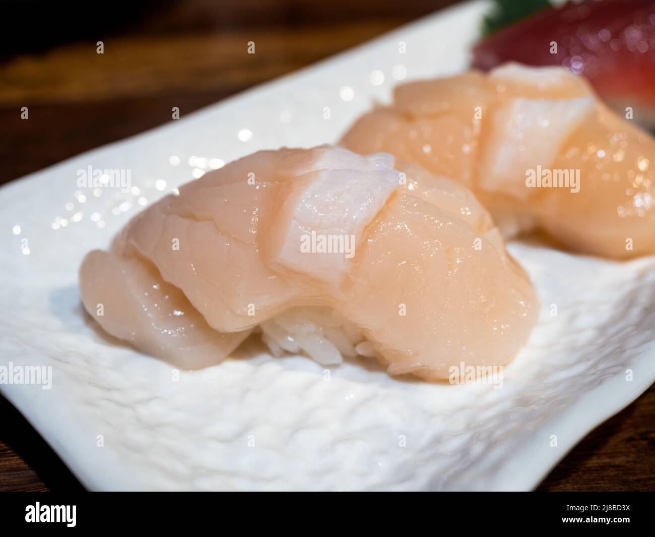 Close up scallop sushi, hotate, hotategai nigiri sushi made of scallop ...