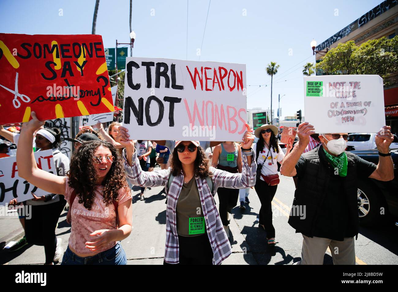 Protesters hold up placards during the rally. Hundreds of abortion ...