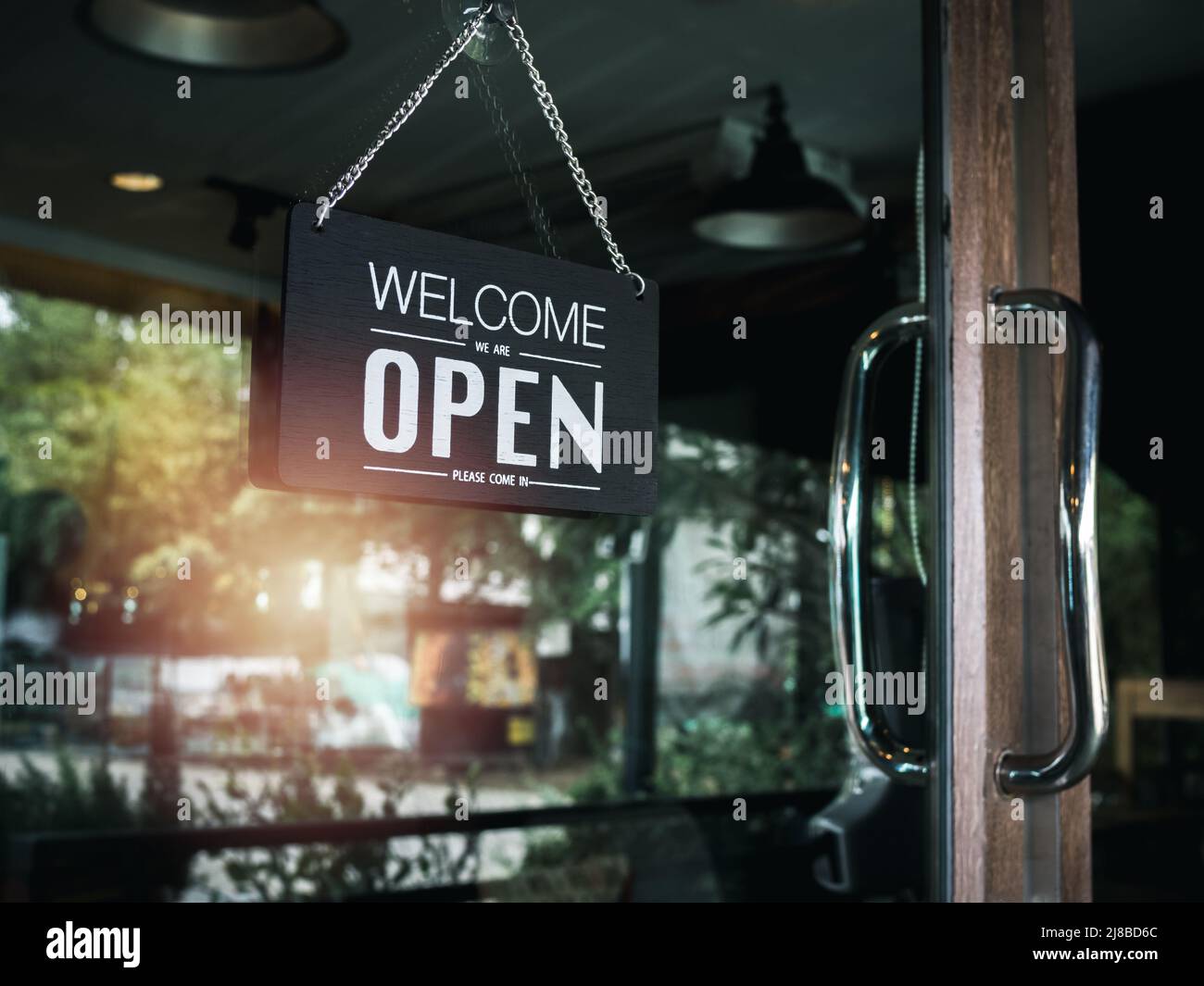 Open sign board with white text on black vintage wooden sign "Welcome ...