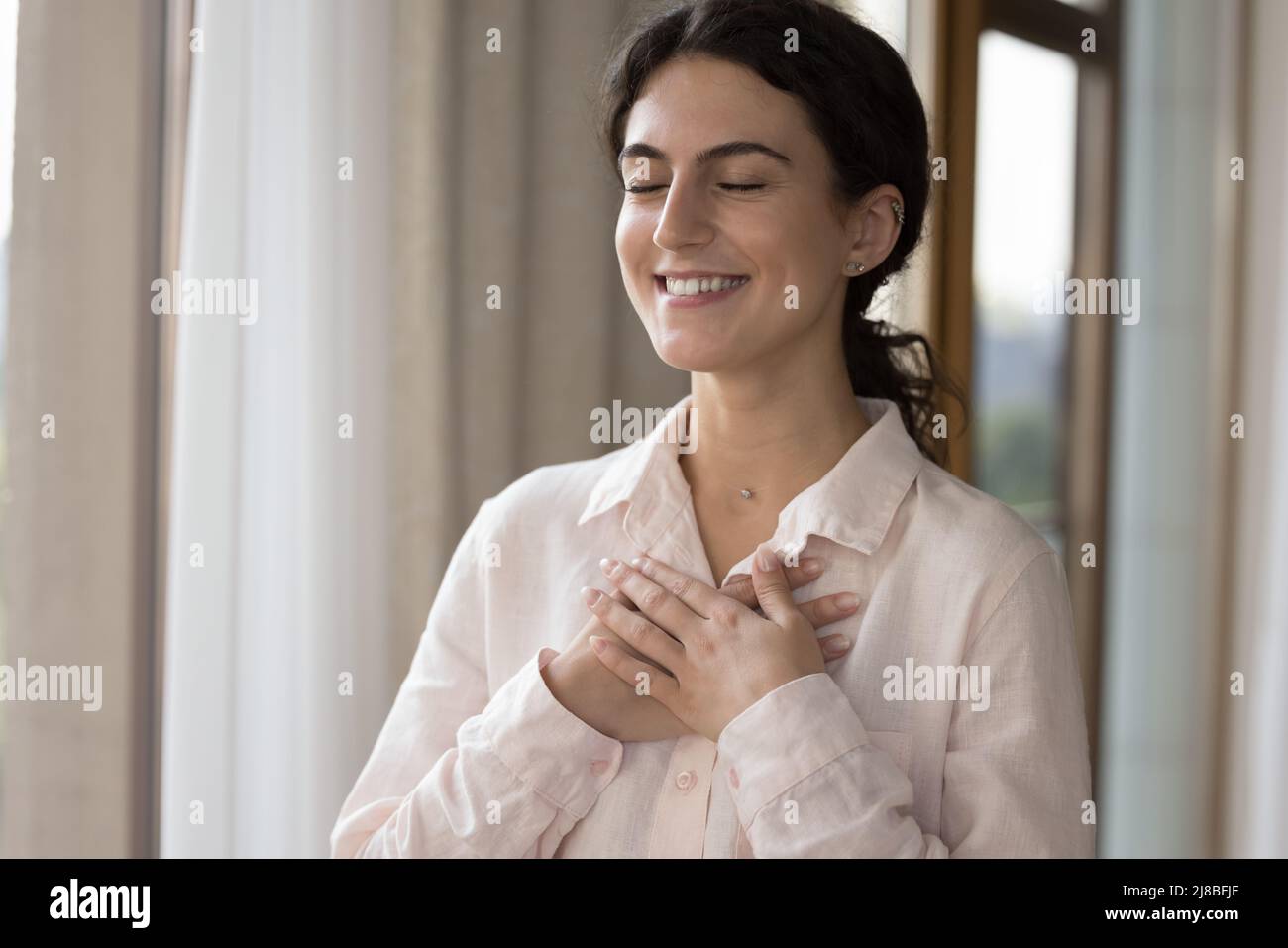 Folded palms hi-res stock photography and images - Alamy