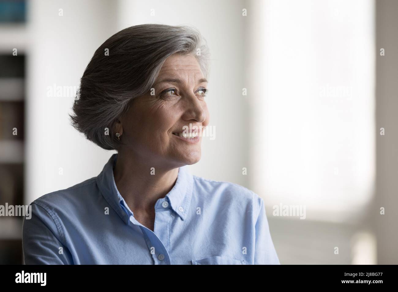 Old lady looking out window hi-res stock photography and images - Alamy