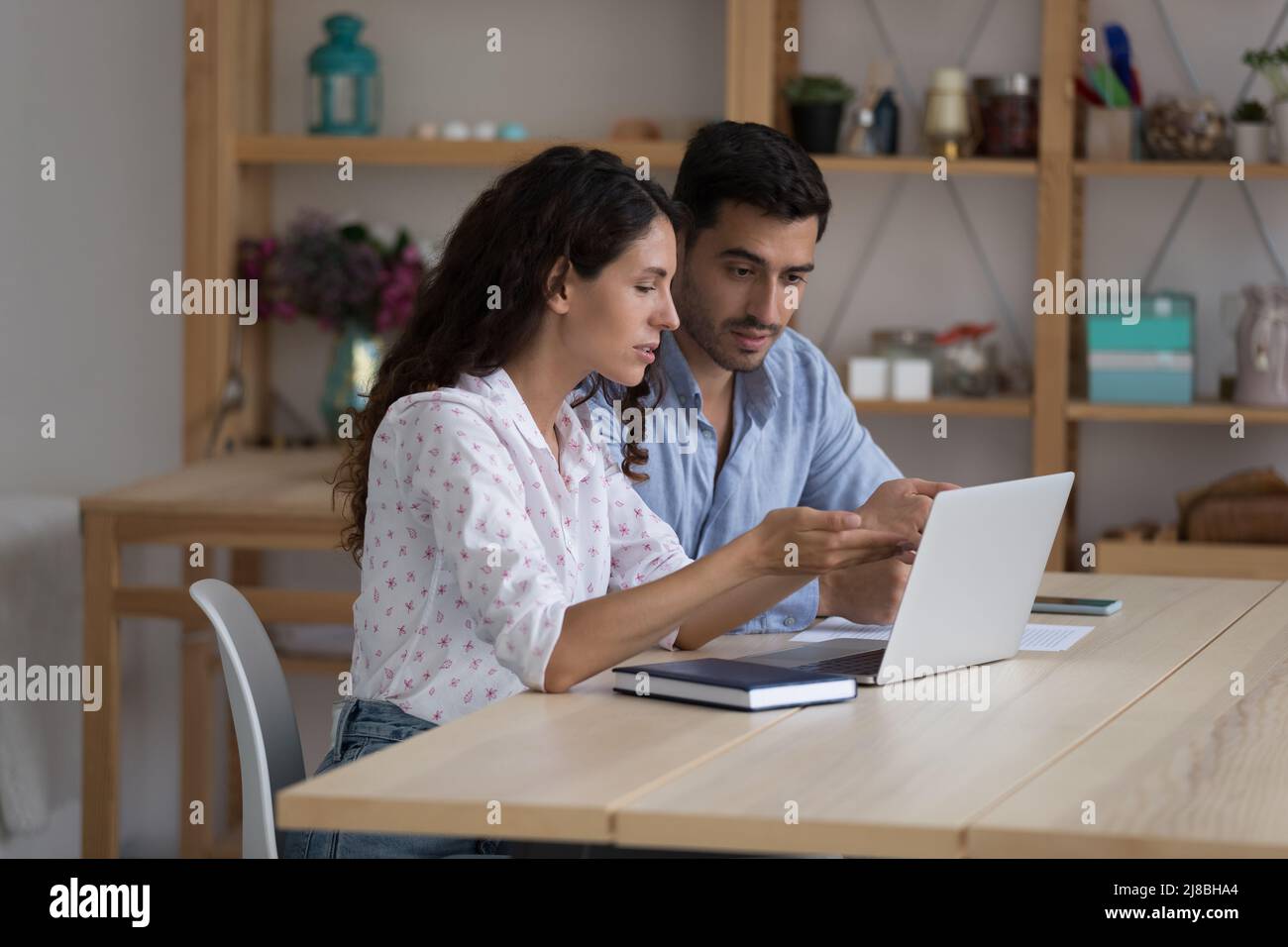 Two business team employees collaborating on online project Stock Photo ...