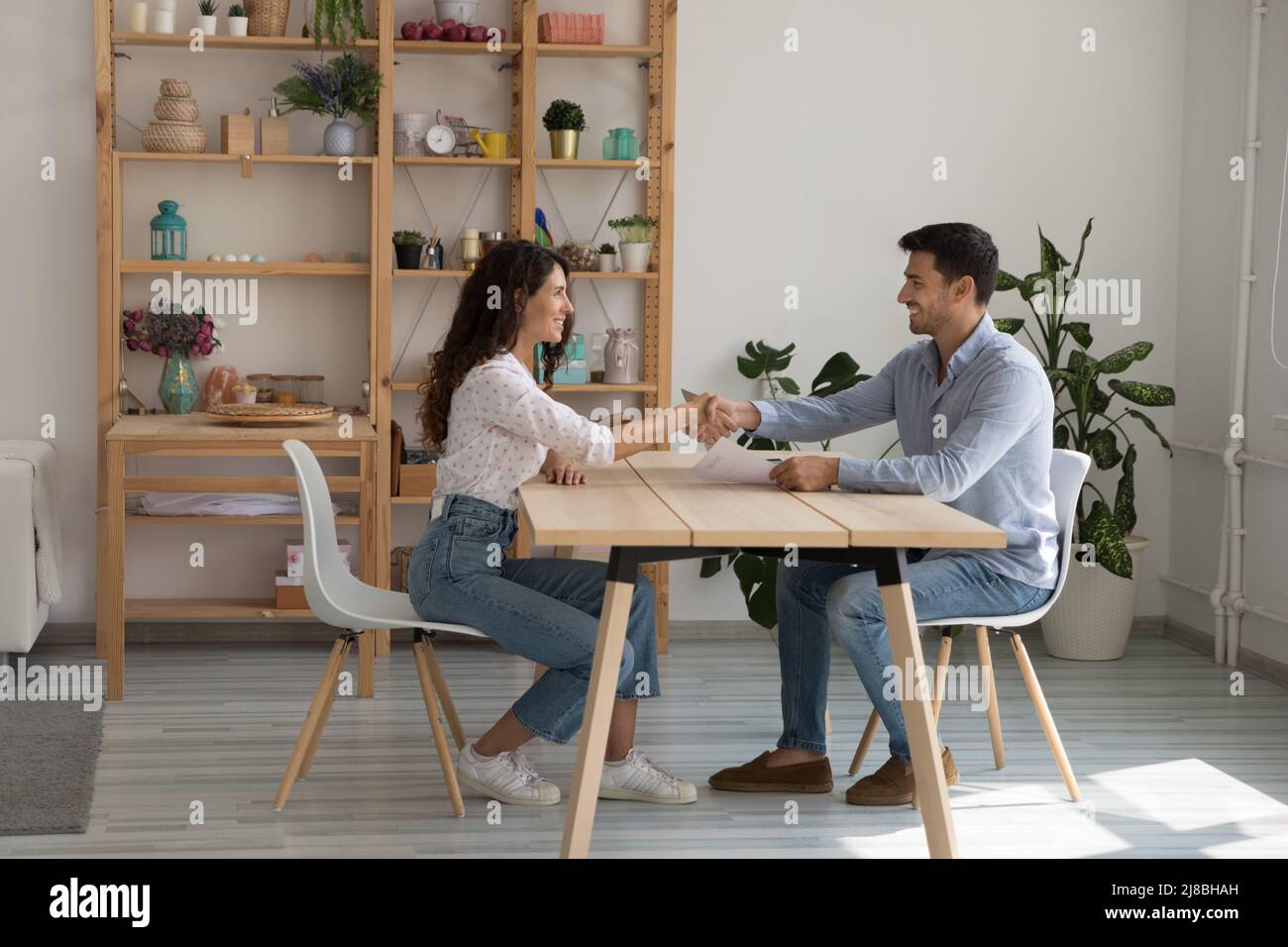 Happy business owner hiring job candidate after successful interview ...