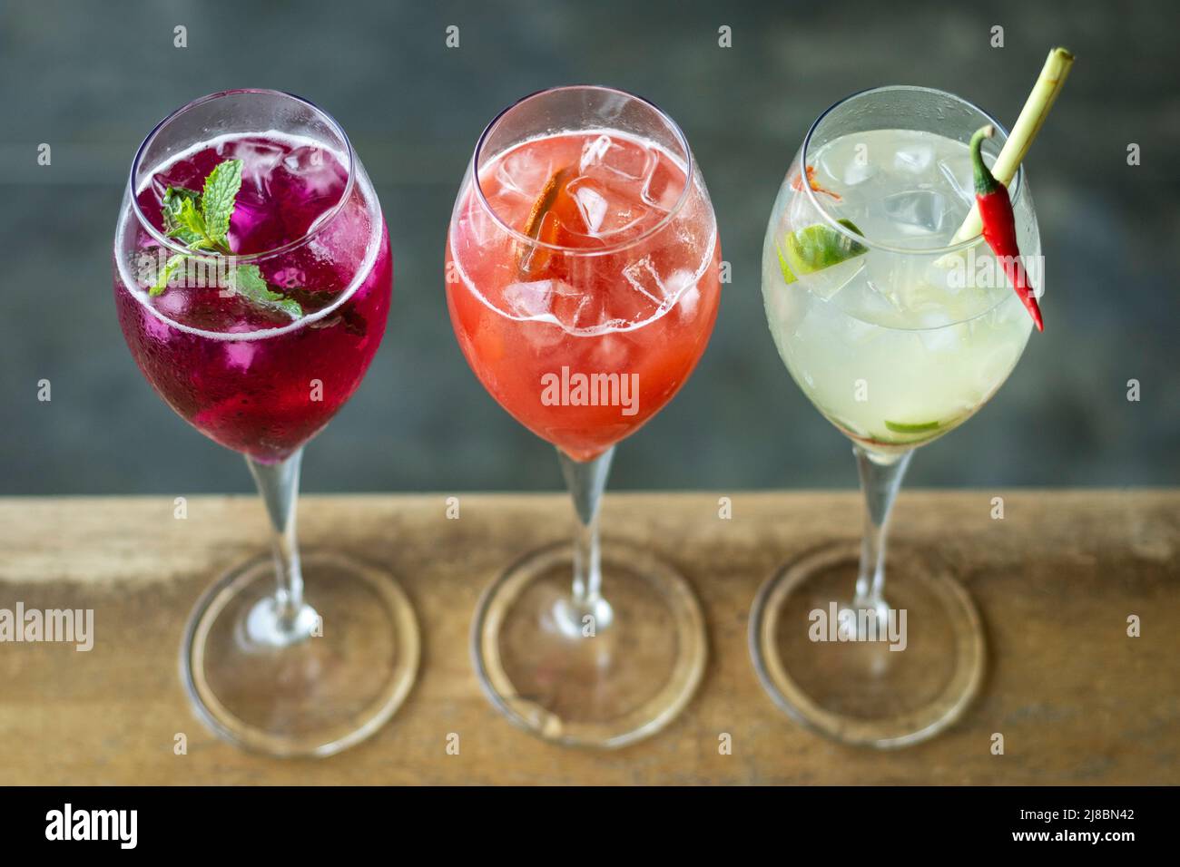 mixed spritzer wine cocktails selection with fruit in outdoor bar table ...