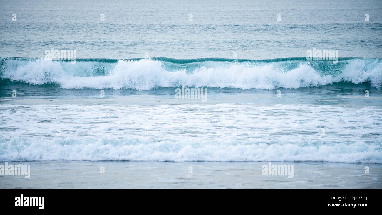 Summer beach, ocean waves on a tropical sea with deep blue wawes. Calm ...