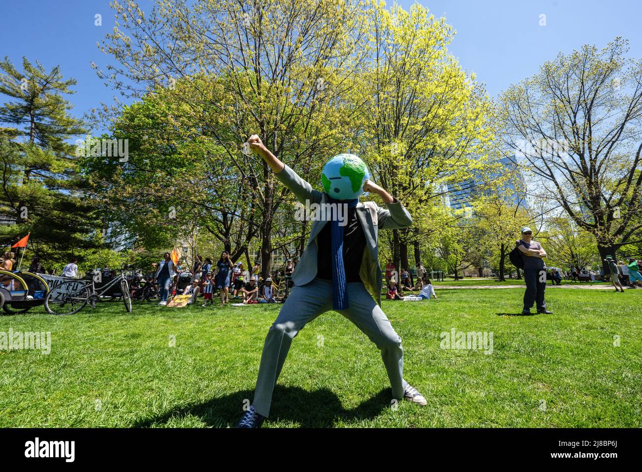 An activist wears a Paper-Mache Earth Globe during the Emergency ...