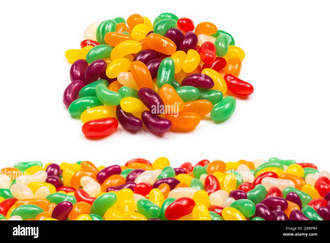 Colorful jelly beans isolated on white Stock Photo - Alamy