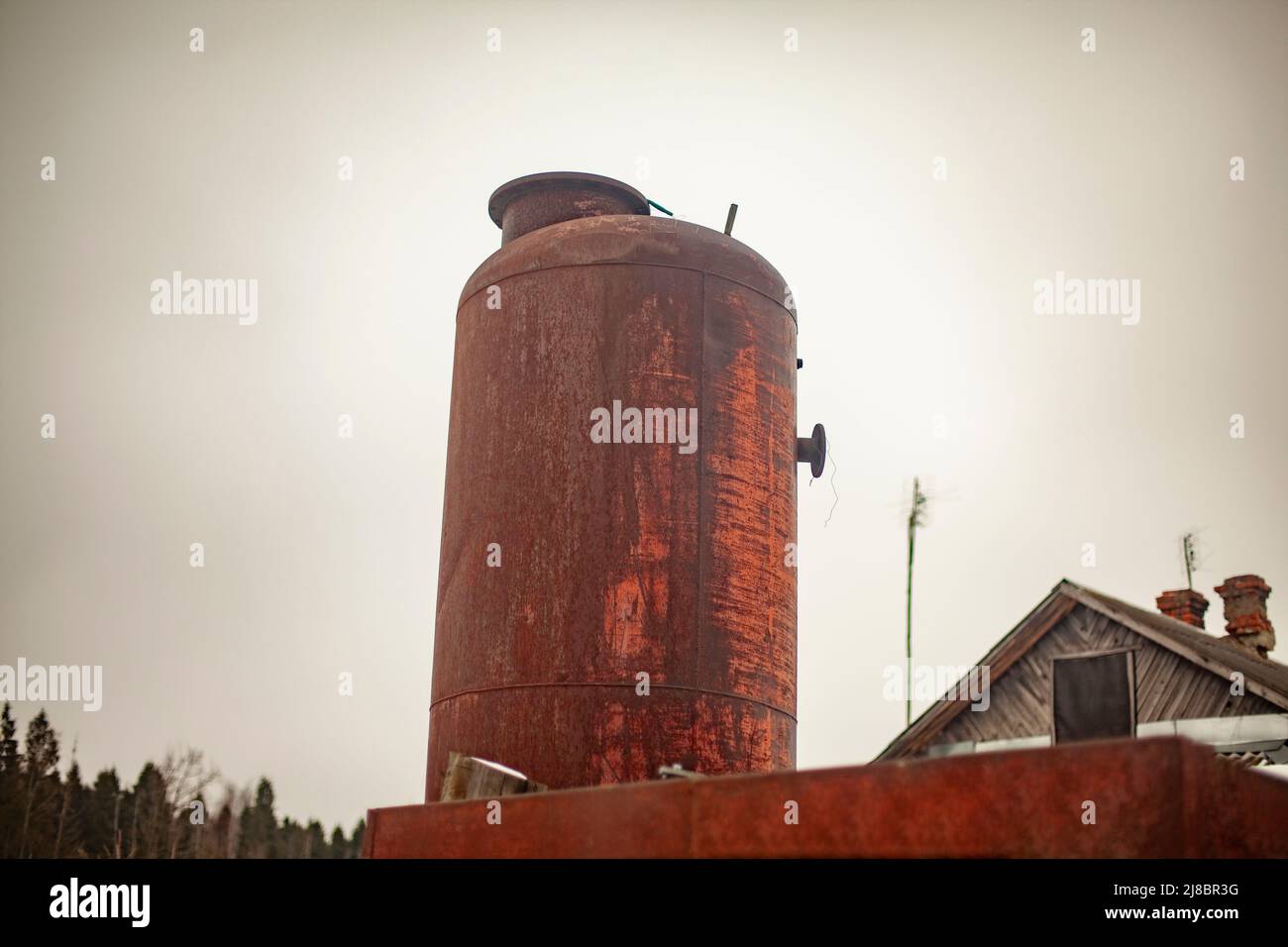 Rusty tank. Large tank of metal on street. Old industrial facility ...