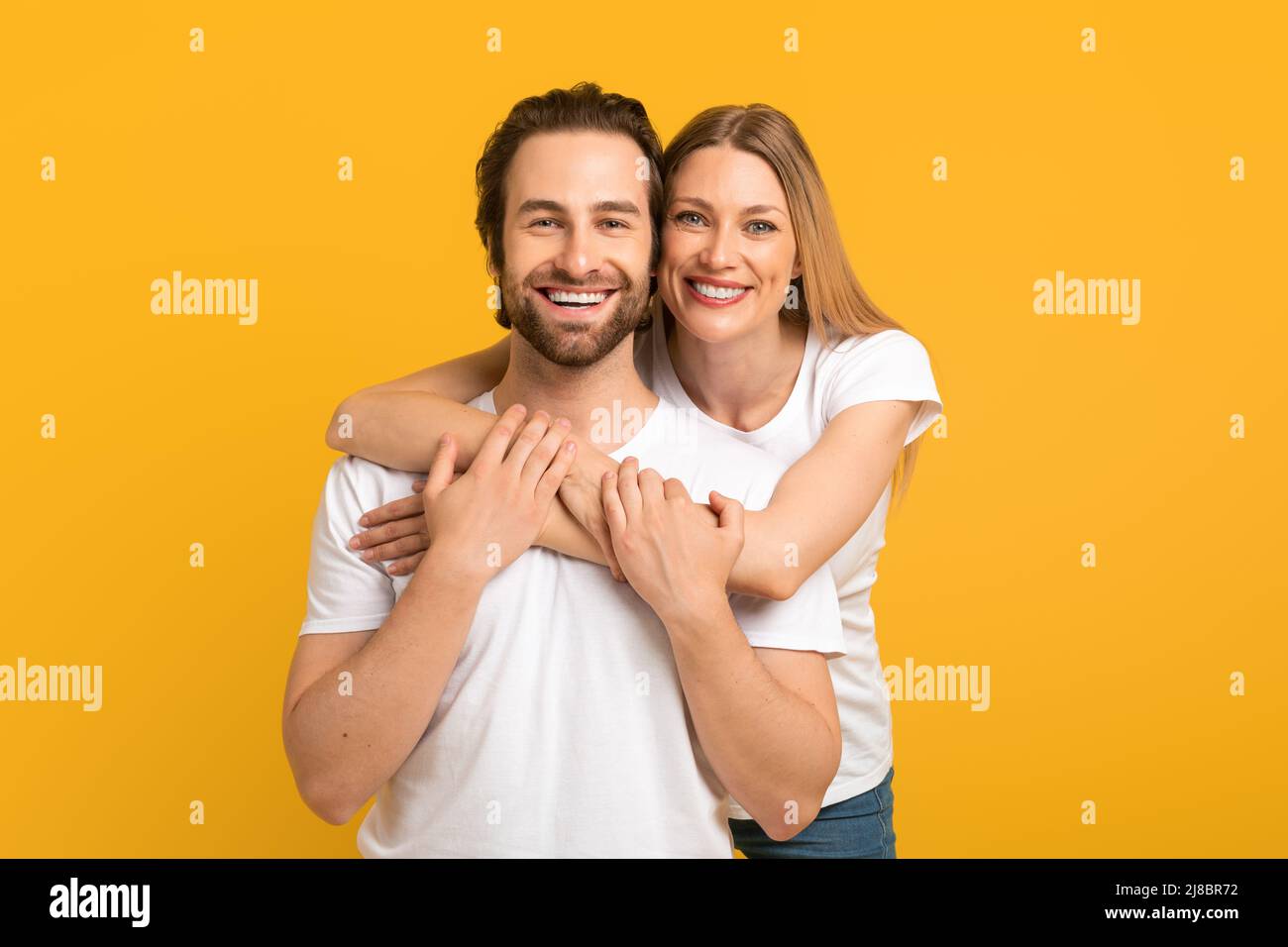 Wife hugging husband from behind hi-res stock photography and images ...
