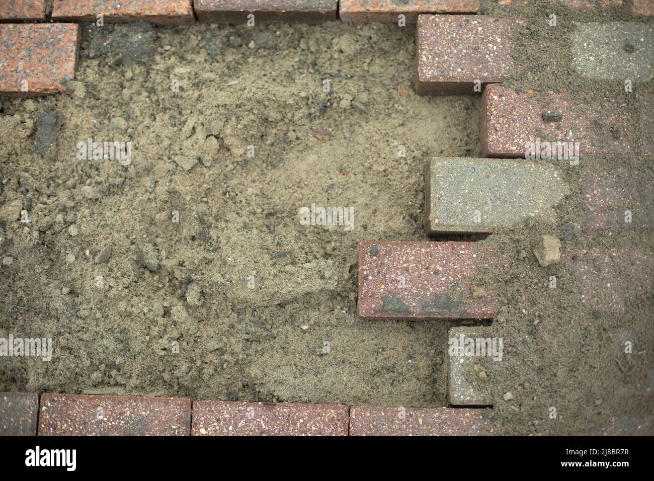 Repair of paving stones. Creating road. Construction of stone ...