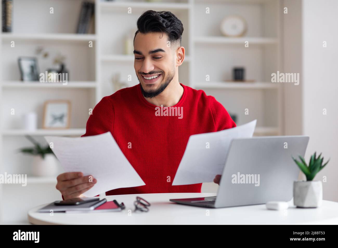 Man cheerful documents work home hi-res stock photography and images ...