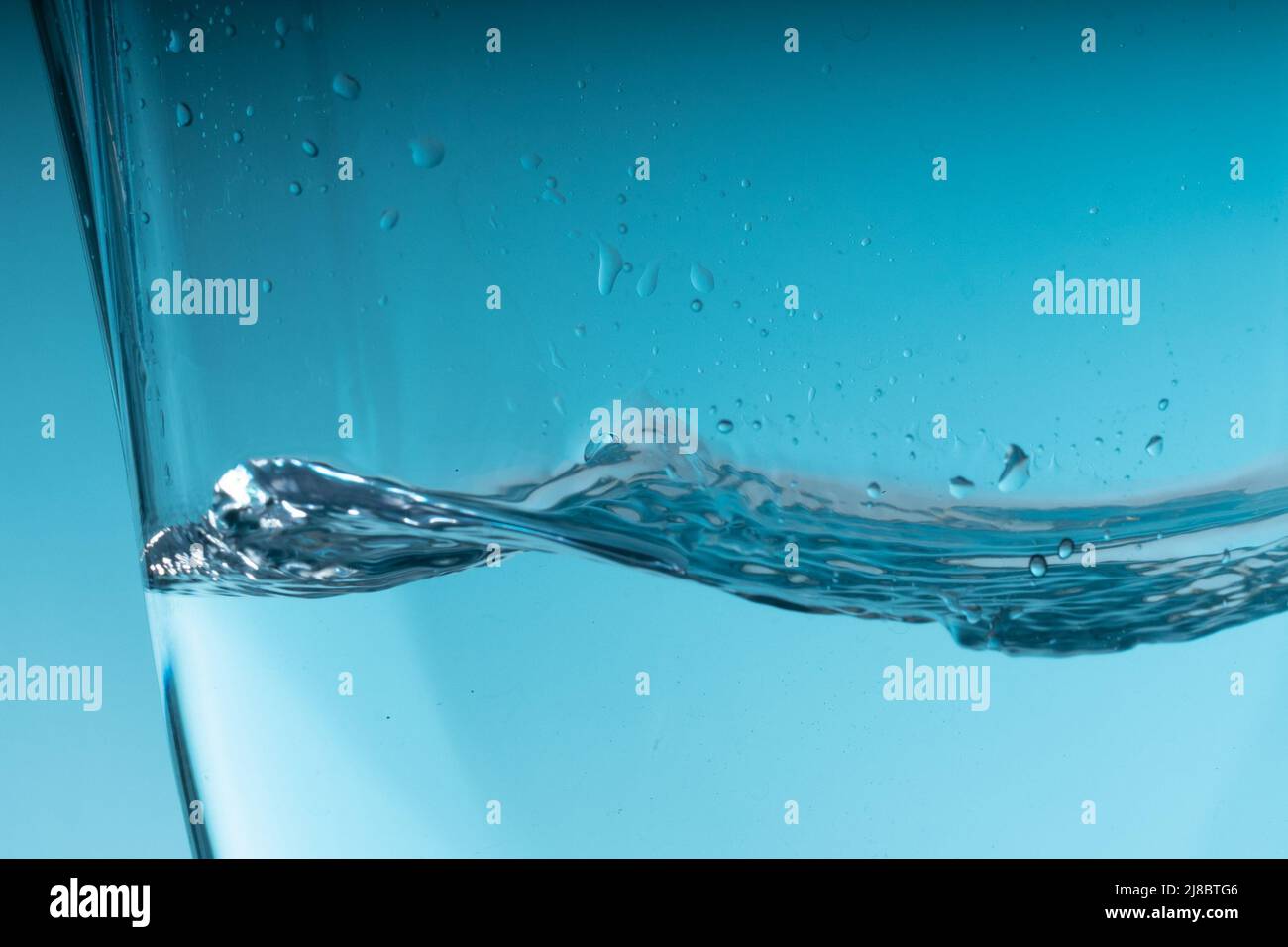 wave of water in a glass vessel. clean clear water. High quality photo ...