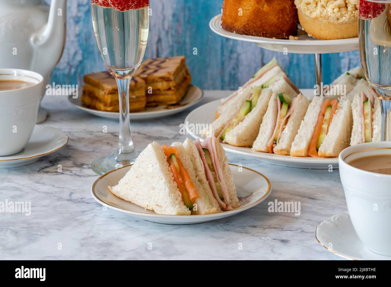 Selection of gourmet cakes and mini canapes with coffee and sparkling ...